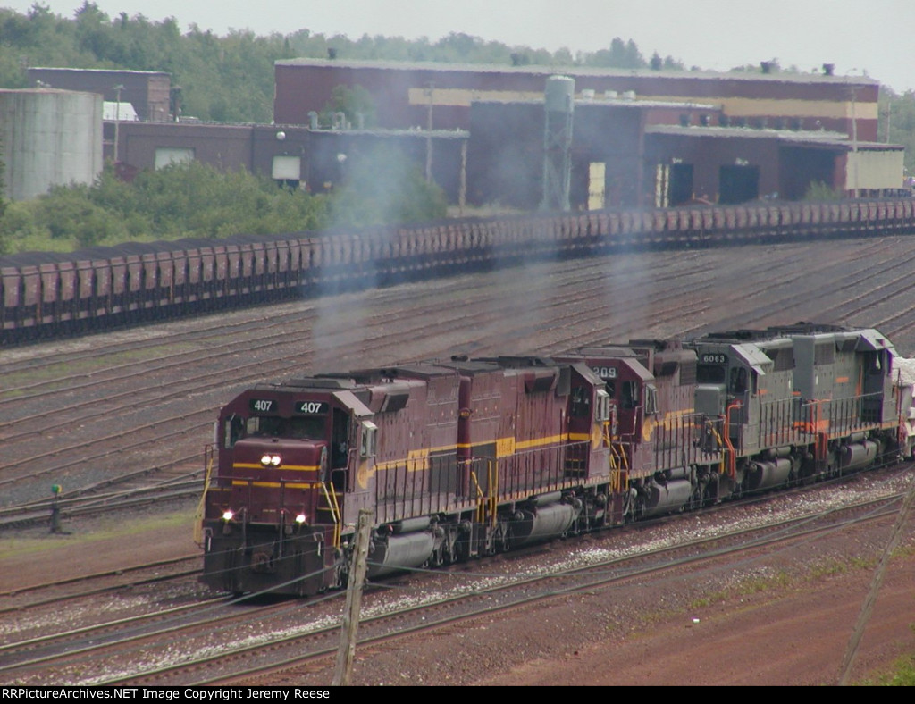 DMIR 407 departing yard with limestone